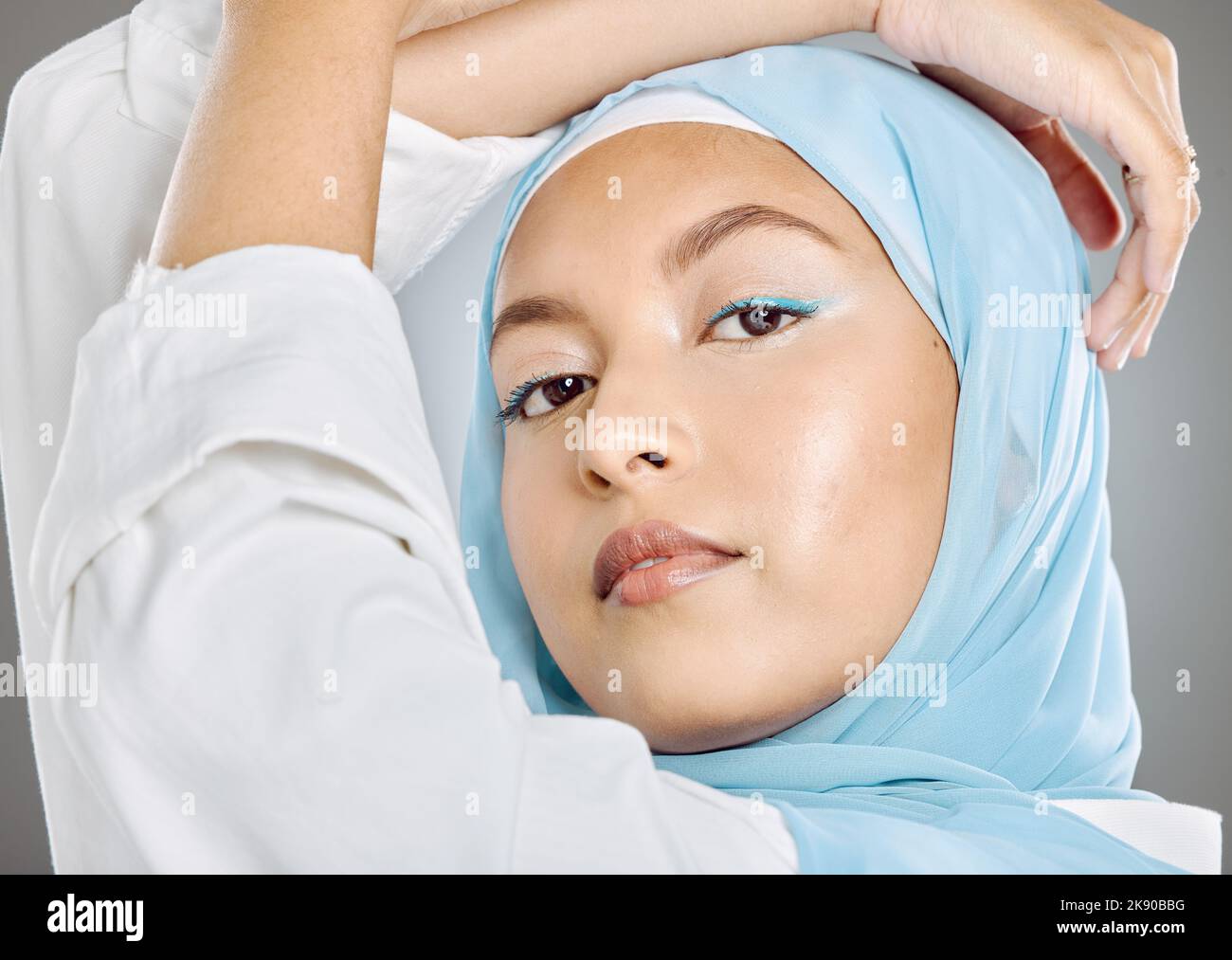 Muslim, woman and face in beauty makeup or cosmetics with hijab against ...