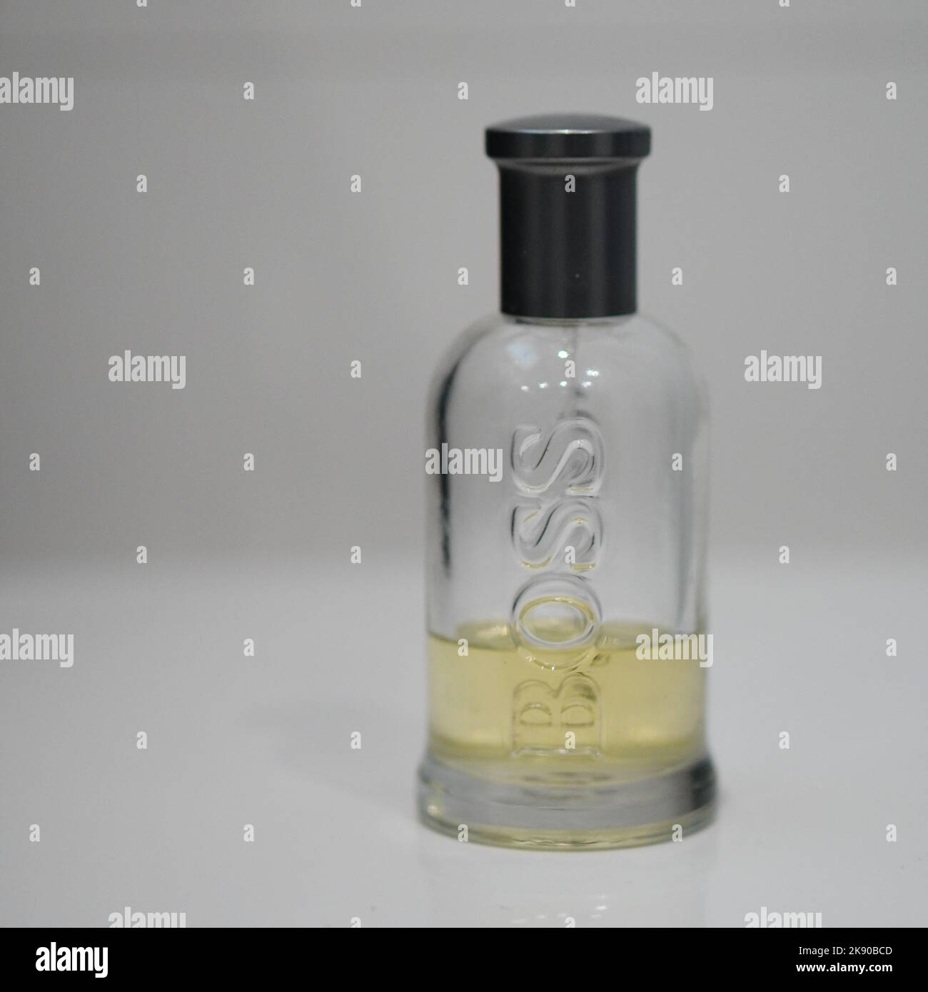 A vertical closeup of Hugo Boss brand men perfume in a spray bottle ...