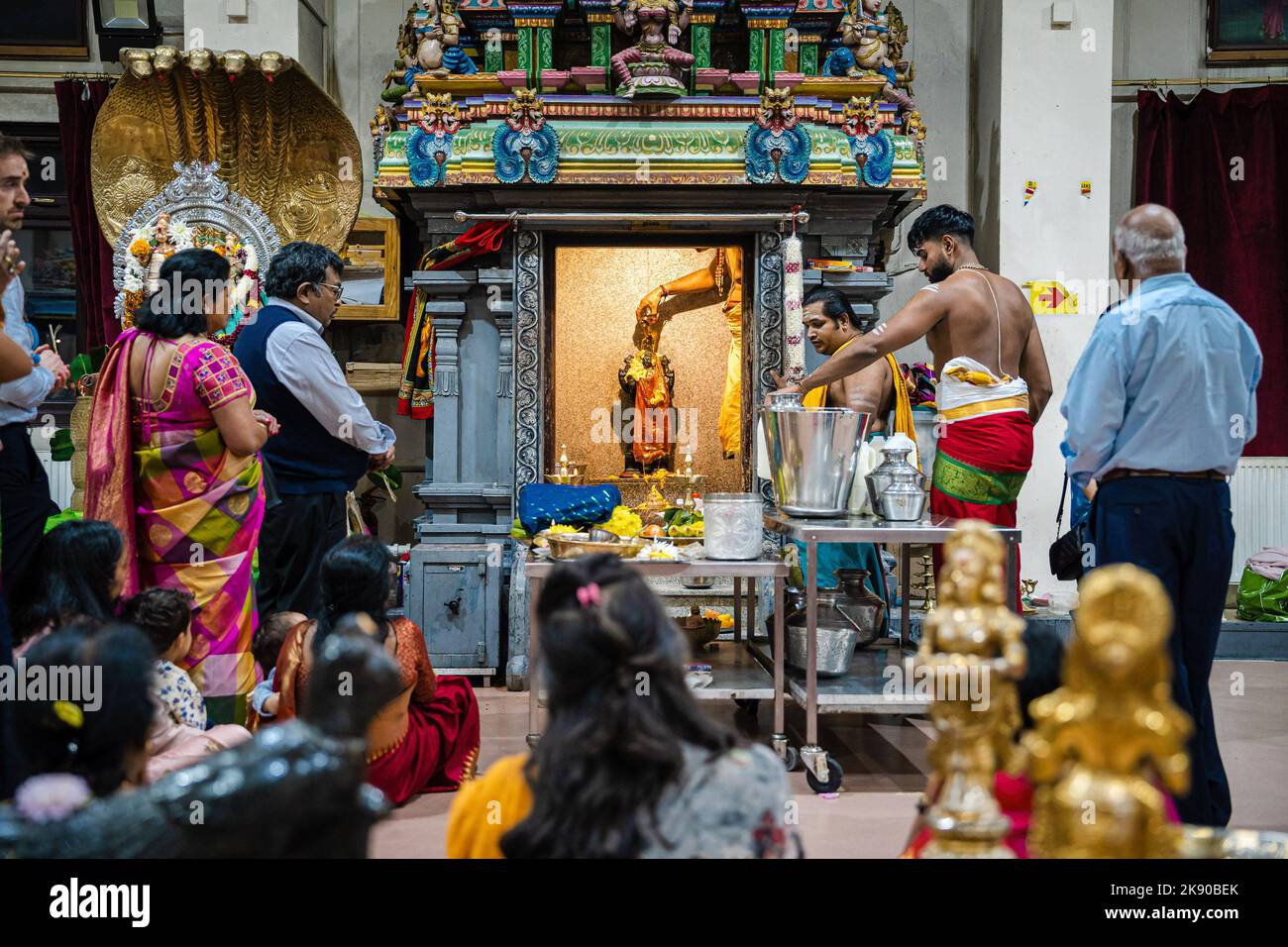 A pandit or Hindu priest performs Abhishekam puja, a Hindu ritual of ...