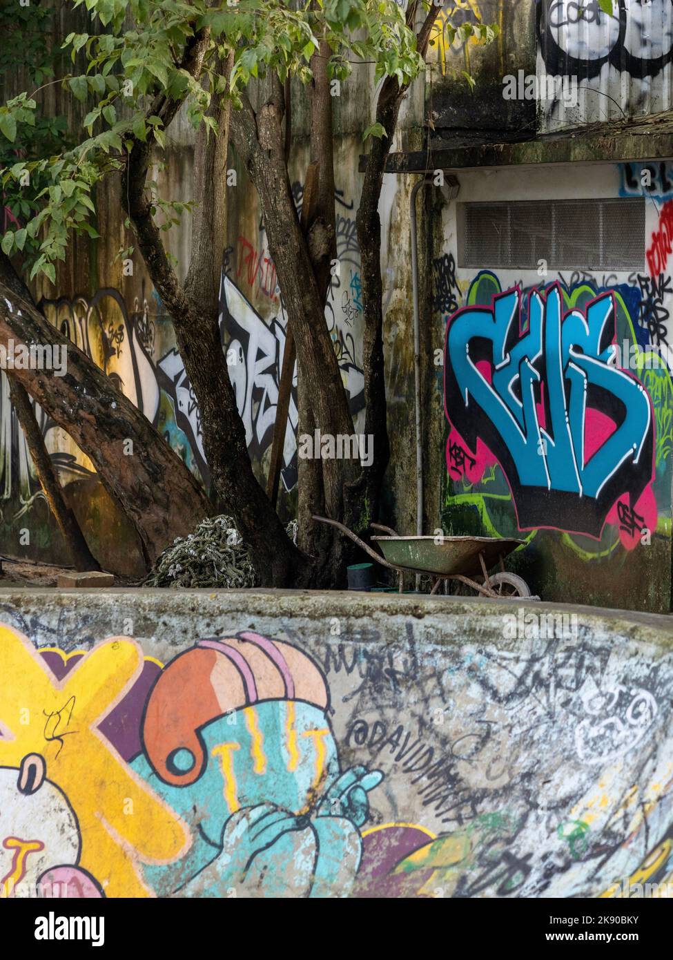 A vertical shot of colored walls of a local skate park near the ...