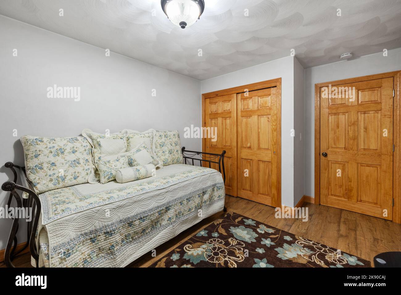 A beautiful rustic house room interior with a large sofa bed and wooden ...