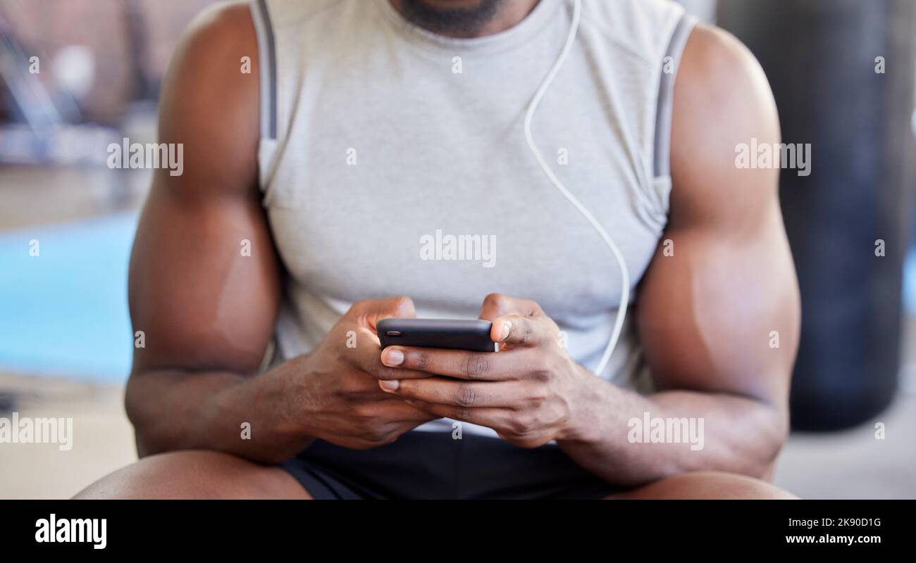 Fitness, hands and phone in gym with man after workout, training or ...