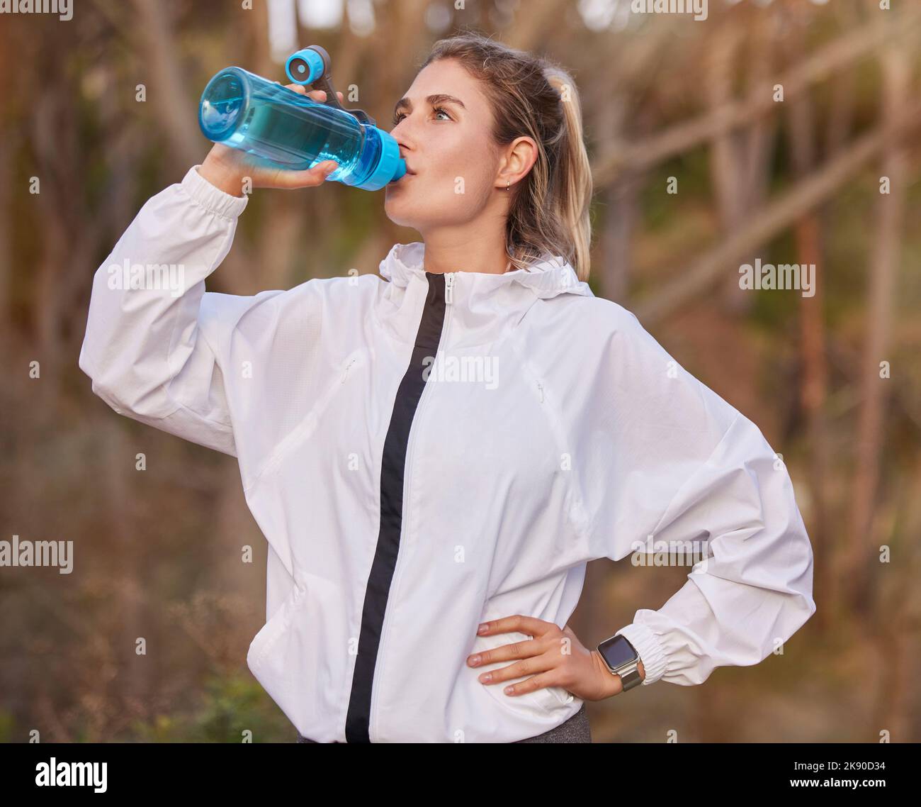 Exercise, woman runner and on break drinking water doing workout, rest ...
