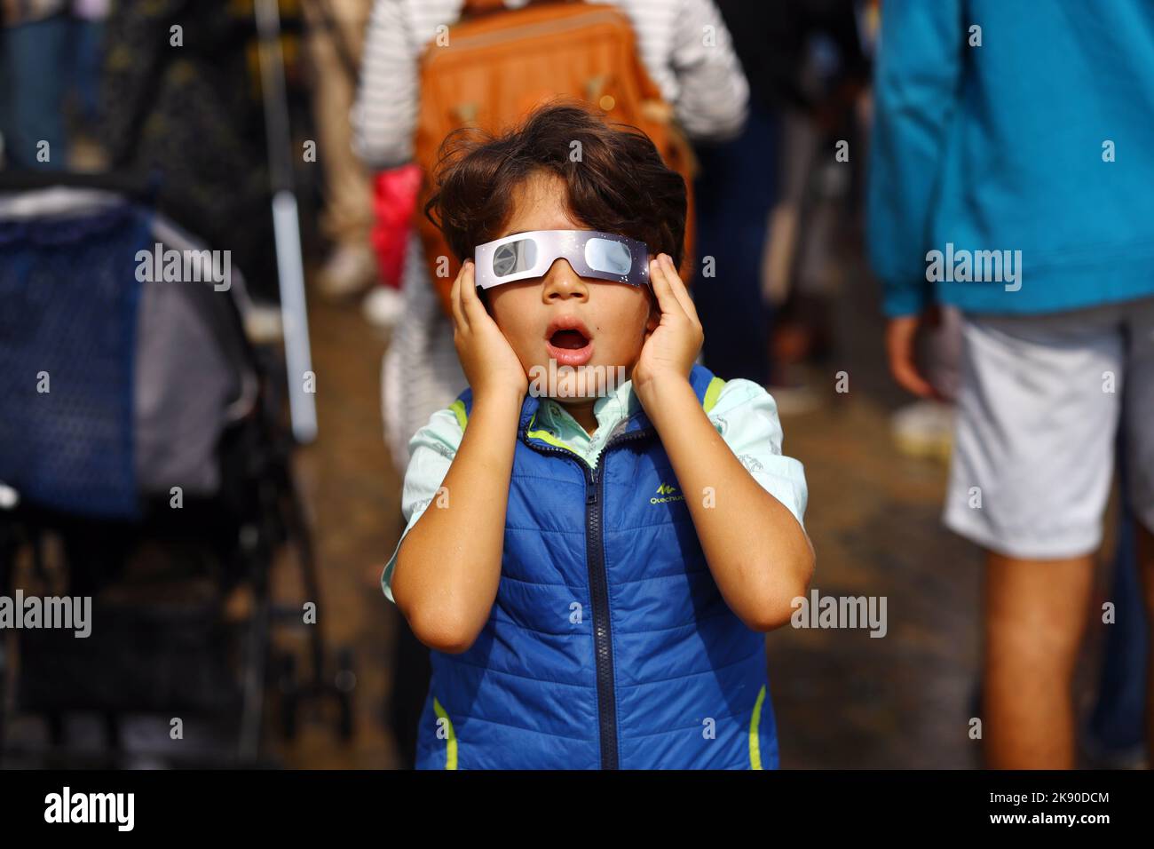 Cairo, Egypt. 25th Oct, 2022. A boy observes a partial solar eclipse ...