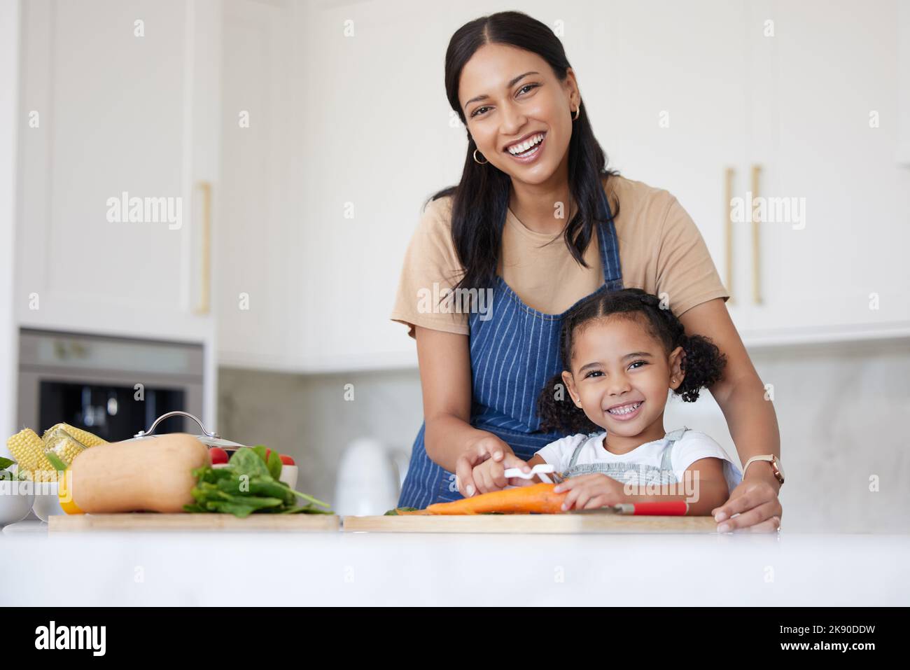 Happy family, girl or child learning from mother cooking or kitchen ...