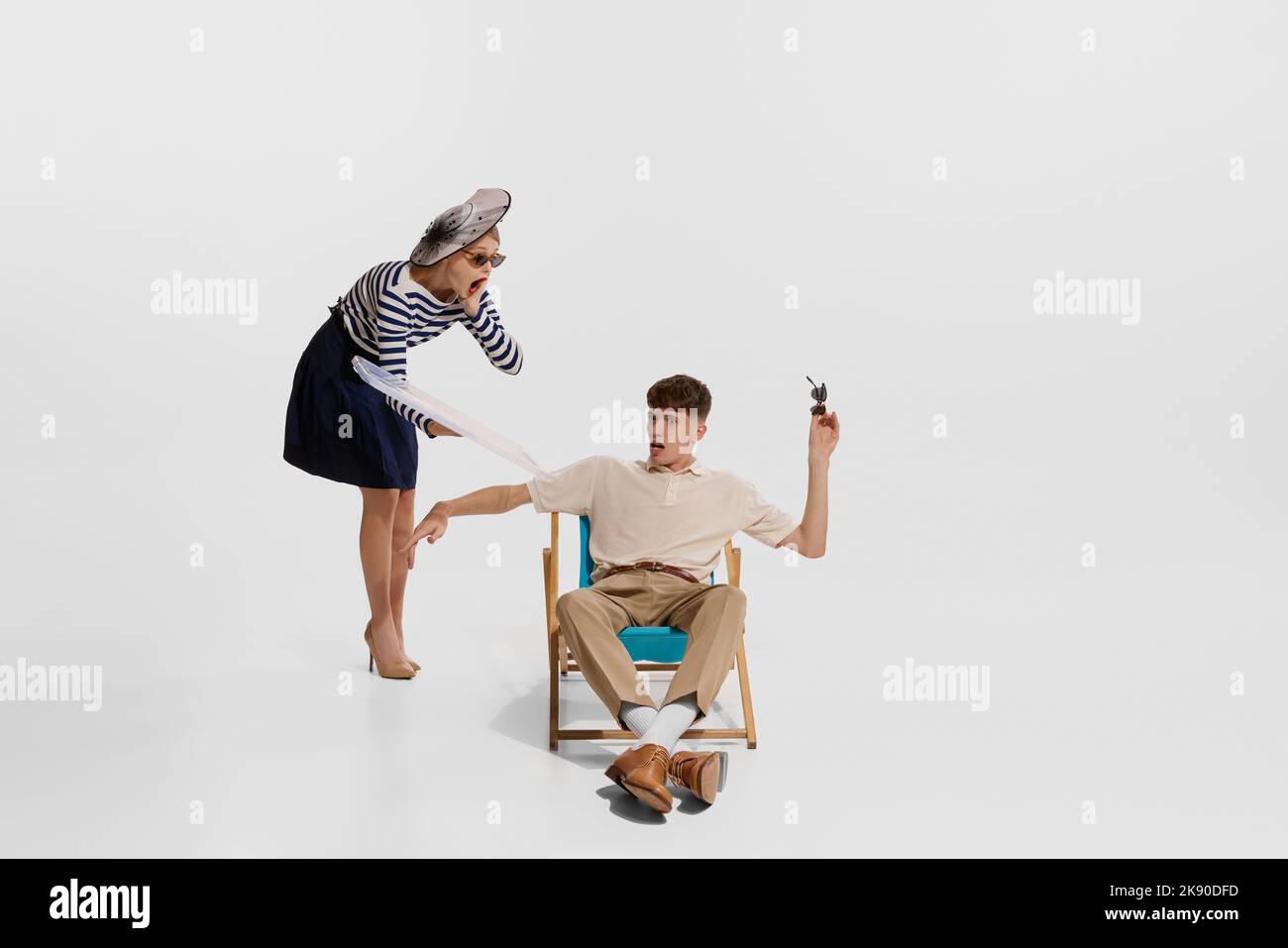 Portrait of young man travelling on cruise. Woman in striped shirt ...