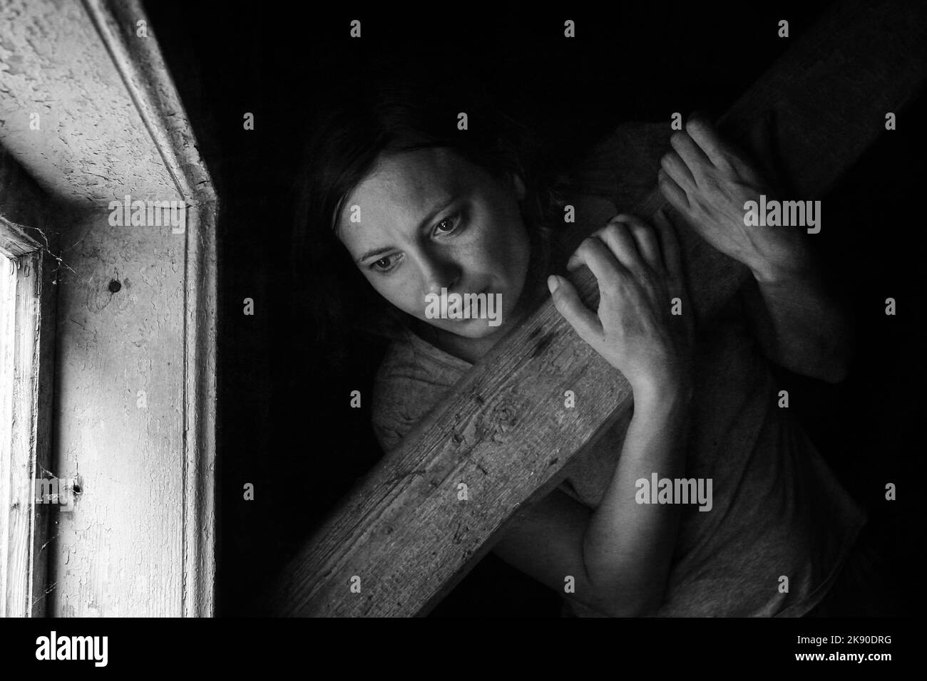 Surreal portrait. Woman looking through the old window. Portrait of a ...