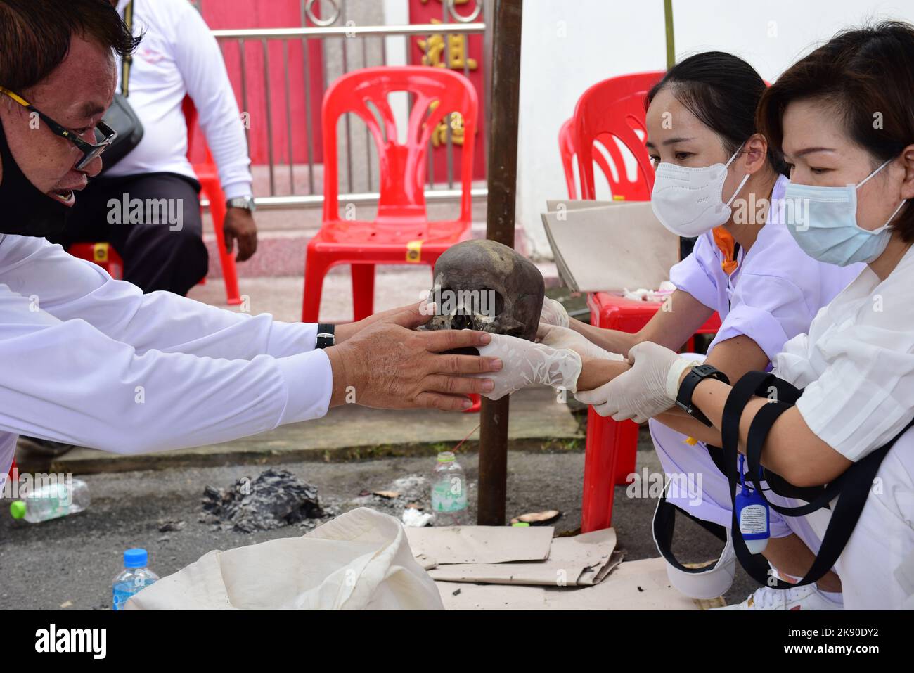 Volunteers, participated in the tradition of exhuming the bodies of the ...