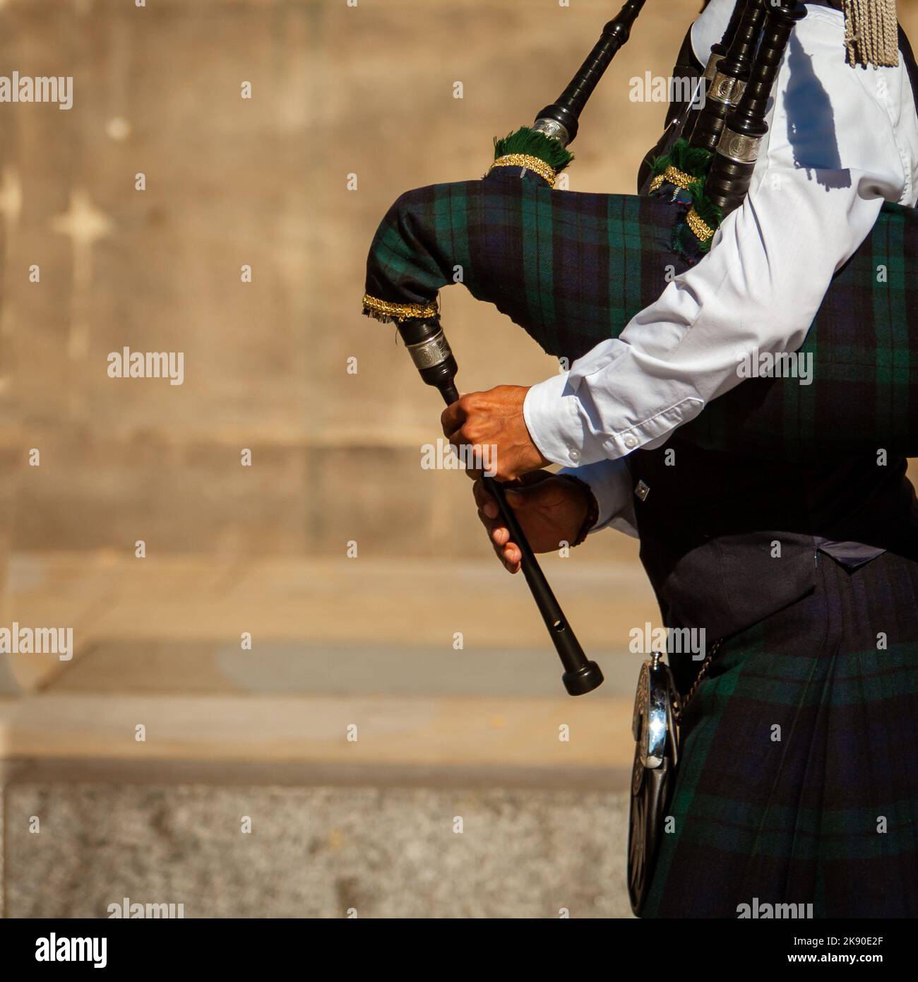 A bagpiper is playing pipes Stock Photo - Alamy