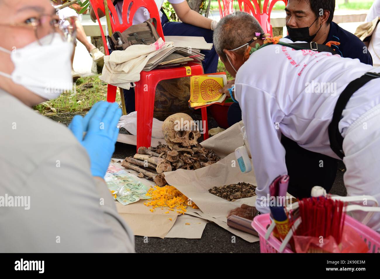 Volunteers, participated in the tradition of exhuming the bodies of the ...