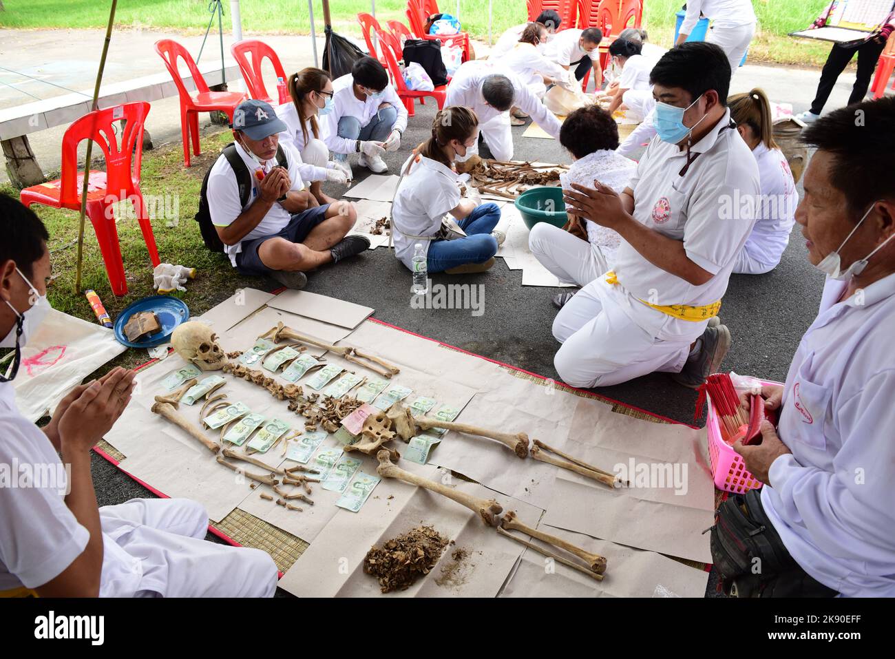 Volunteers, participated in the tradition of exhuming the bodies of the ...