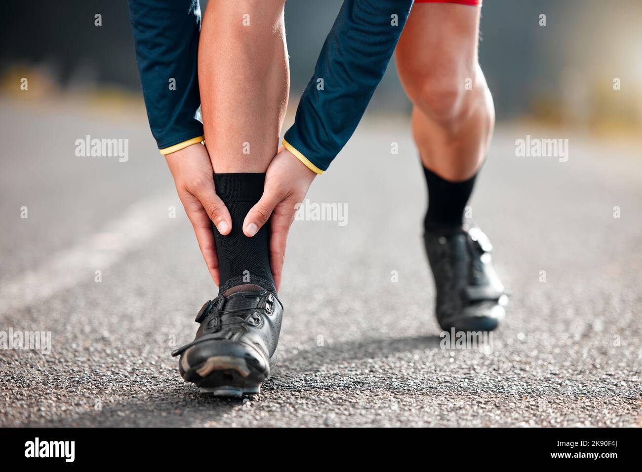 Run injury, feet and sport runner athlete on a outdoor road feeling ...