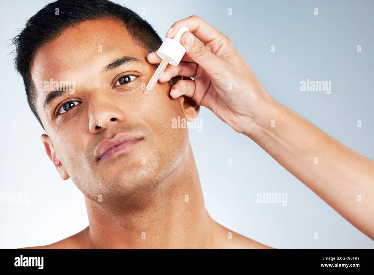 Cosmetics, man and skincare use serum for natural beauty, confidence ...