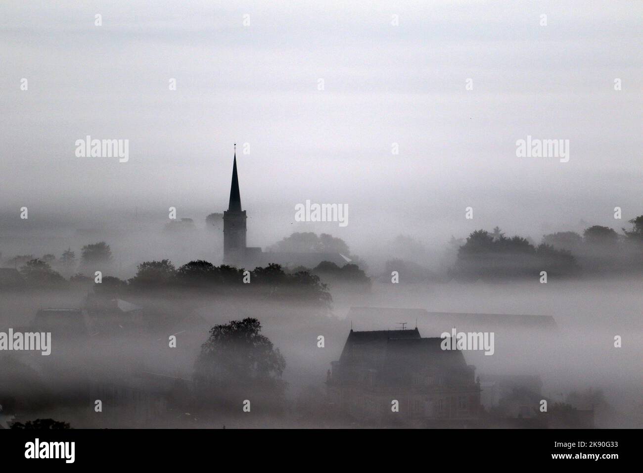 A tower of rural church on misty autumn morning Stock Photo - Alamy