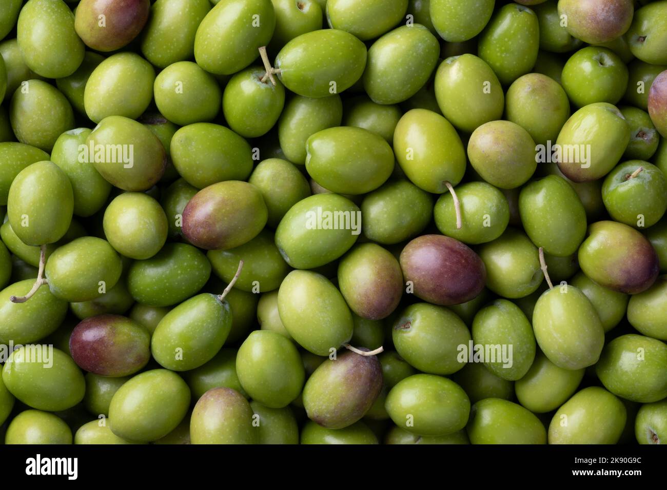 Fresh raw green olives close up full frame as background Stock Photo ...