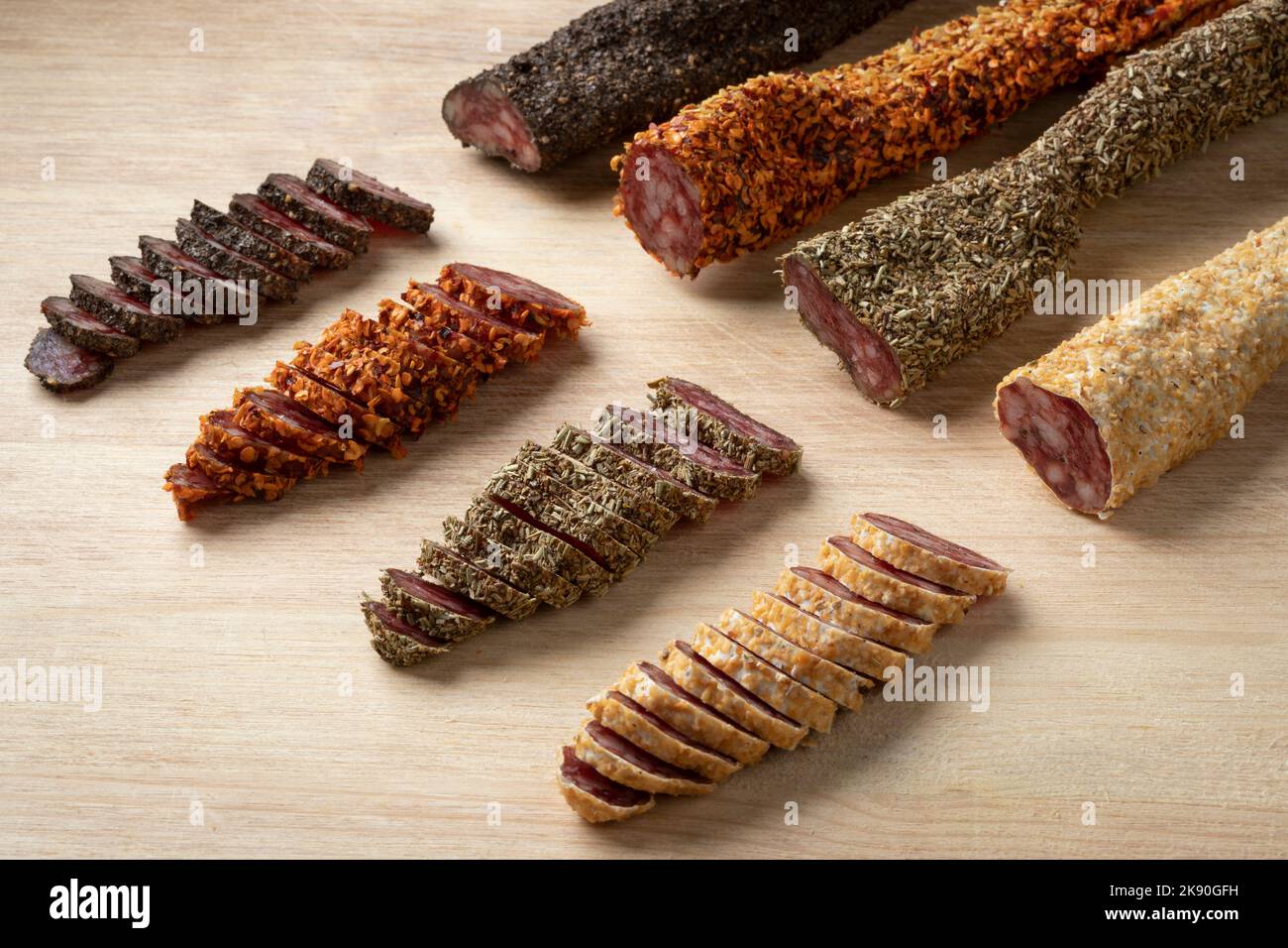 Variaton of traditional Spanish fuet and slices close up on a ...