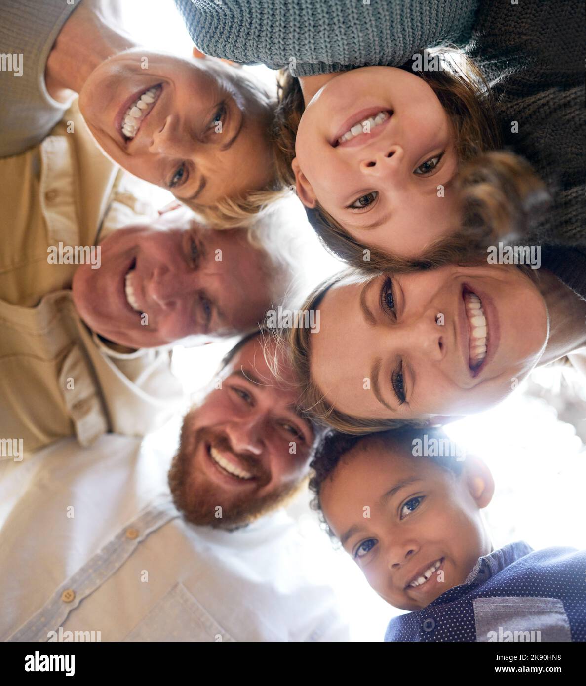 Family, face and below huddle for support of grandparents, parents and ...