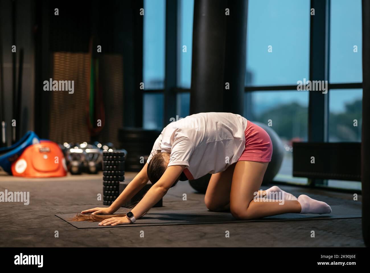 Young woman working out, doing yoga or pilates exercise Stock Photo - Alamy