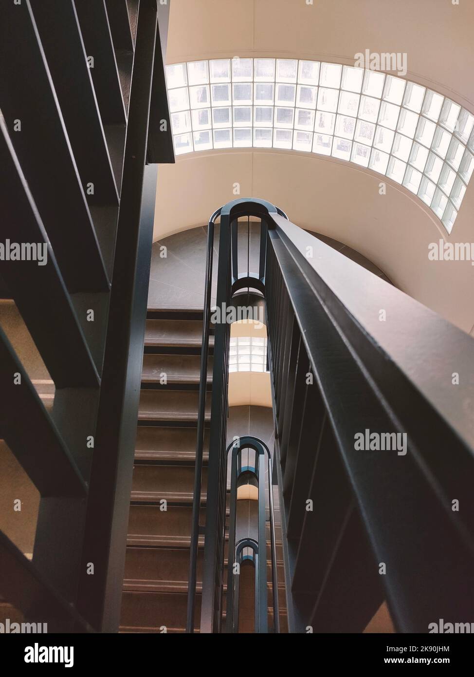 An interior design of a dark brown wooden staircase in a building from ...