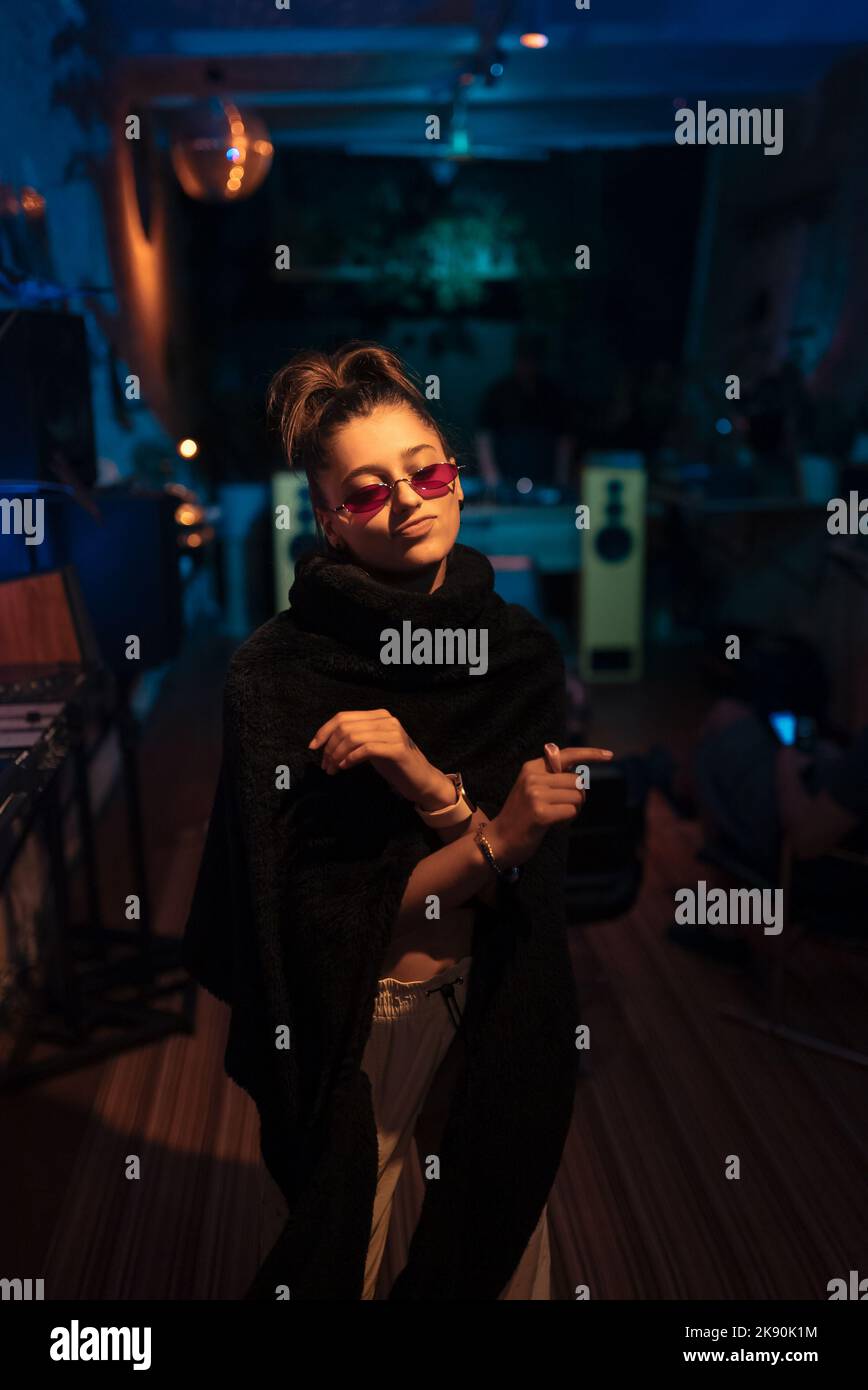 Beautiful female dancing in a small club Stock Photo - Alamy