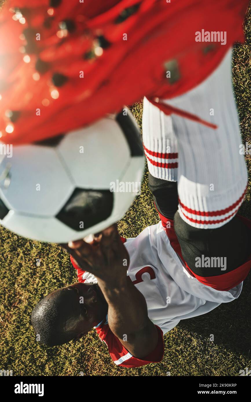 Above, soccer player and ball training, outdoor and on field for match ...