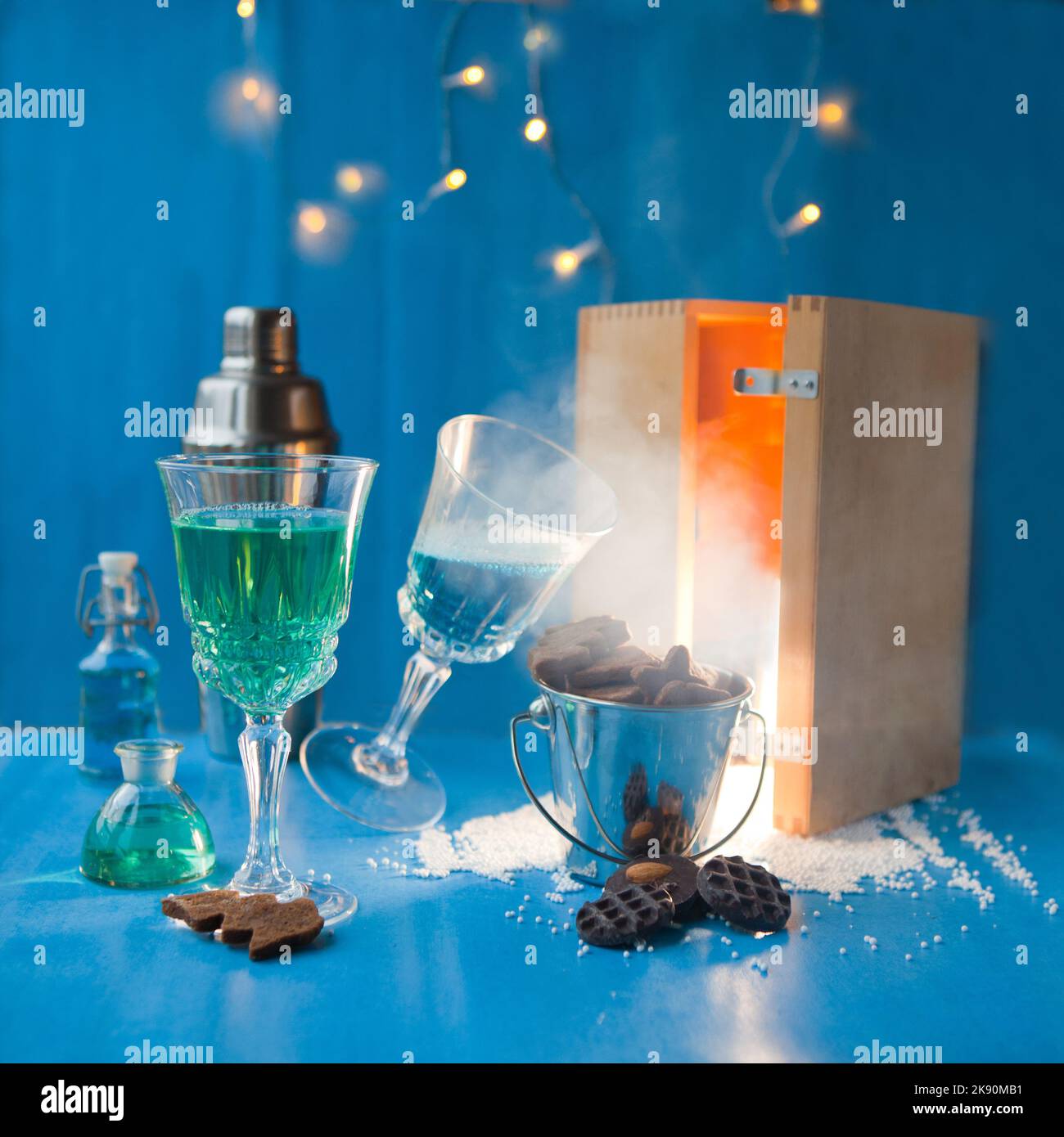 wine glasses with colorful liquid and smoke. shades of blue. Wine bar ...