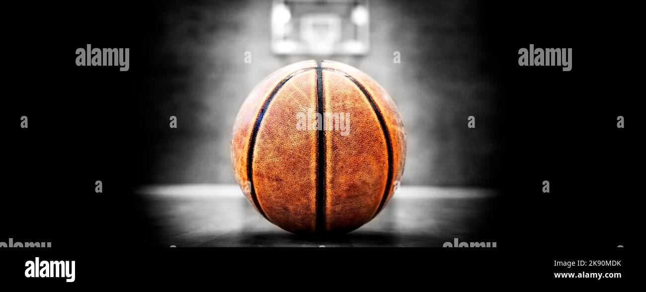 Basketball court with ball hoops rims hardwood floor and lights for ...