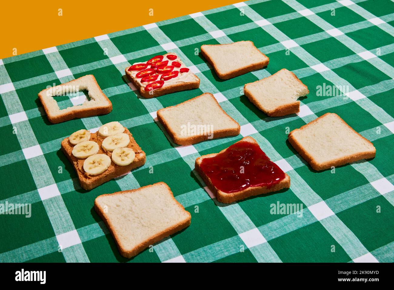 Creative composition with different toasts on plaid green and white ...