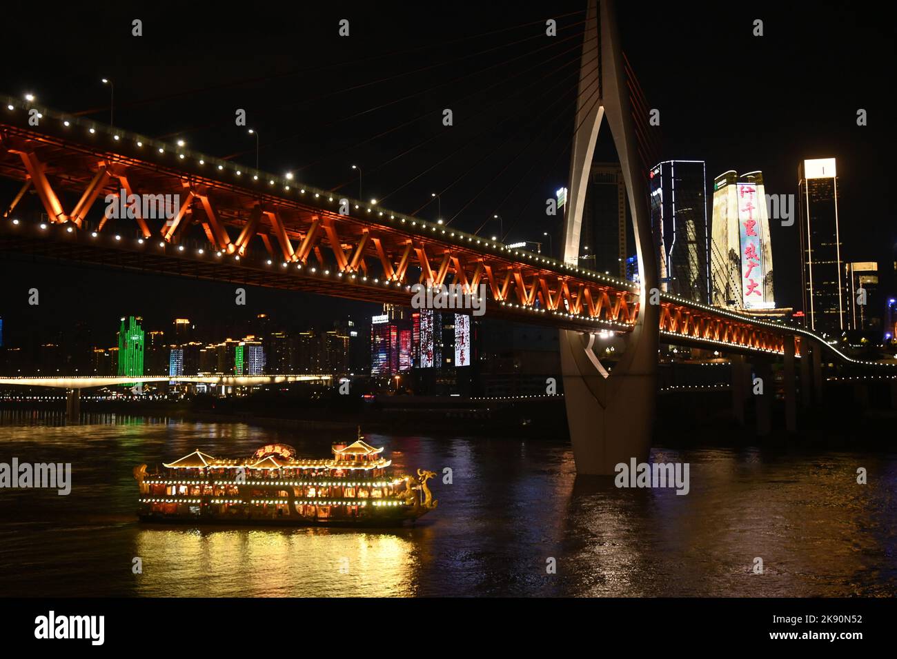 A low-angle of Qiansimen night bridge illuminated with colorful lights ...