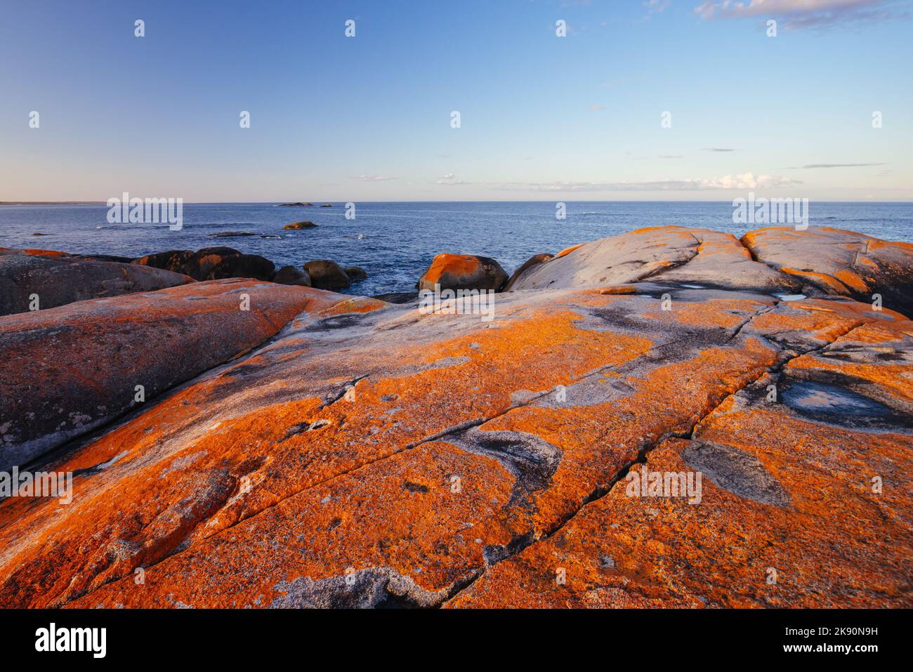 Lichen covered rock formations at the Gardens at sunset in the Bay of ...