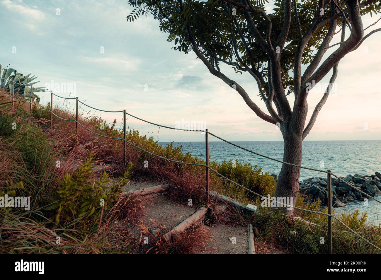 A beautiful view of a staircase against a background of wavy ocean ...