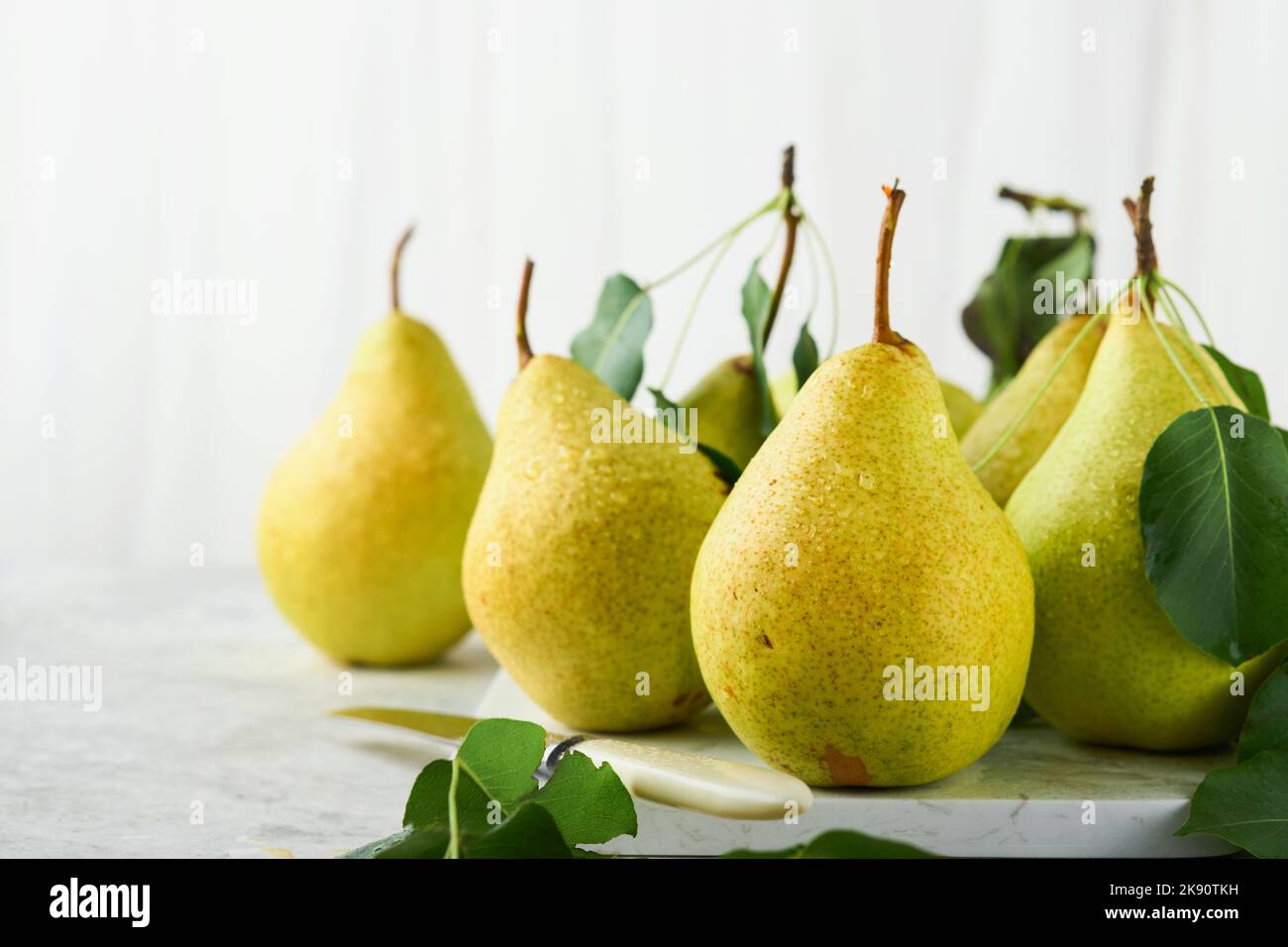 Pears. Fresh sweet organic pears with leaves on stand or plate on old ...
