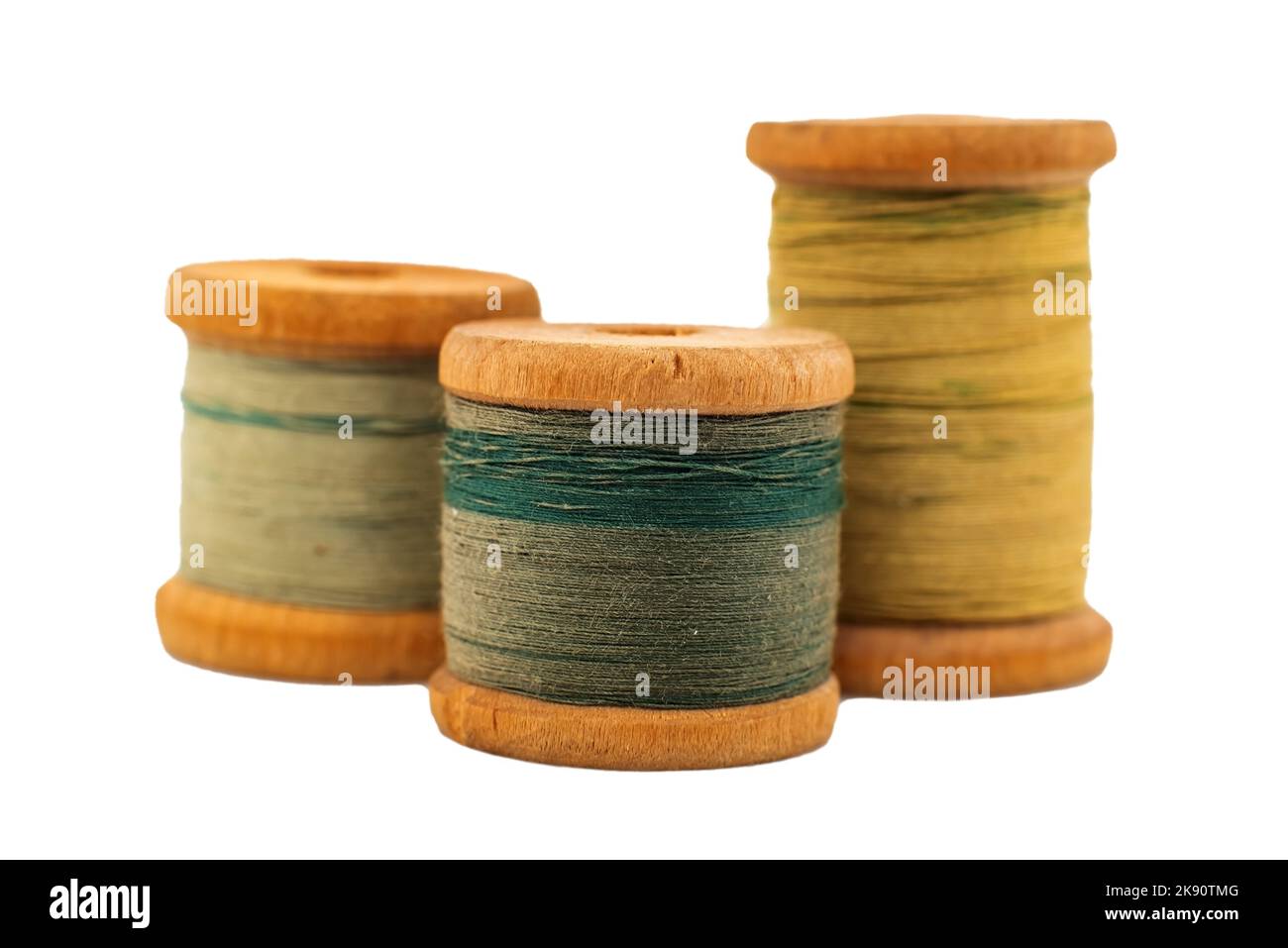 Old wooden spool of thread on a white background close-up. Threads for ...