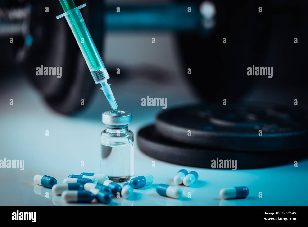 A pharmaceutical syringe with needle and medical pills - illegal doping ...