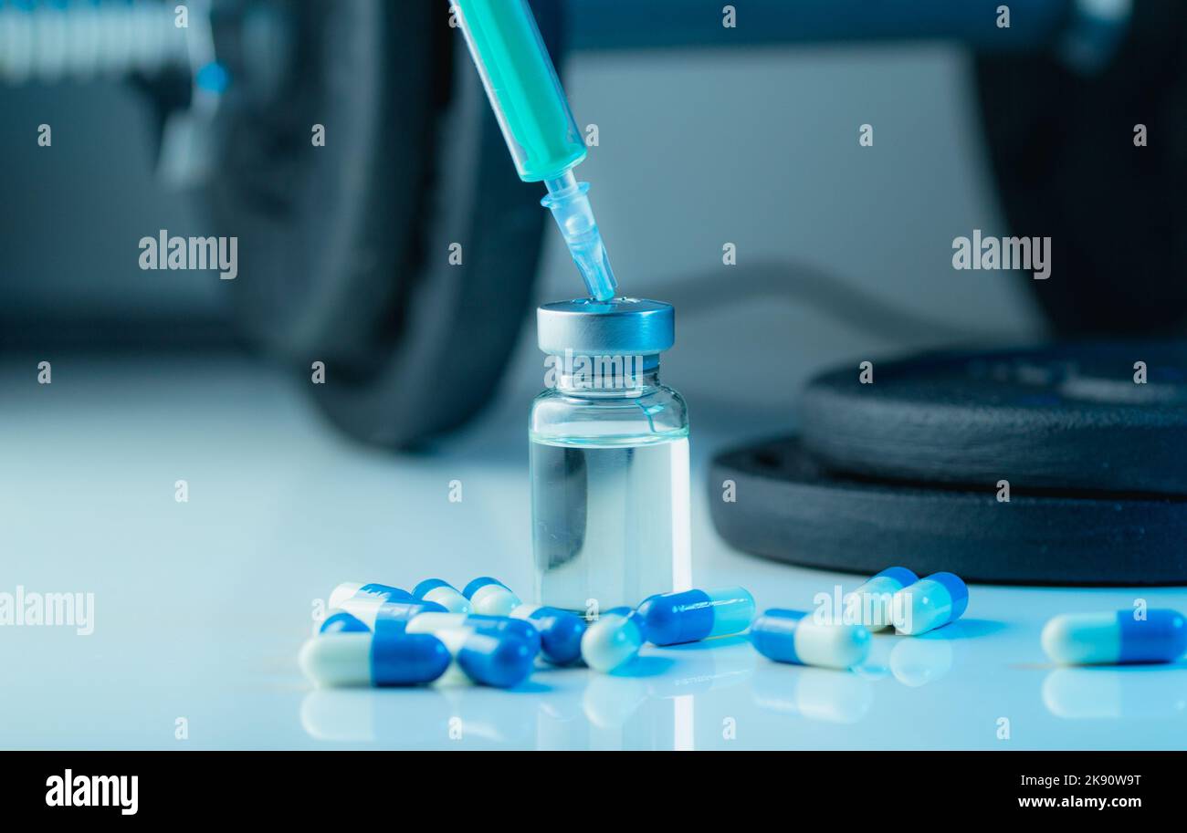 A pharmaceutical syringe with needle and medical pills - illegal doping drugs in sport Stock ...