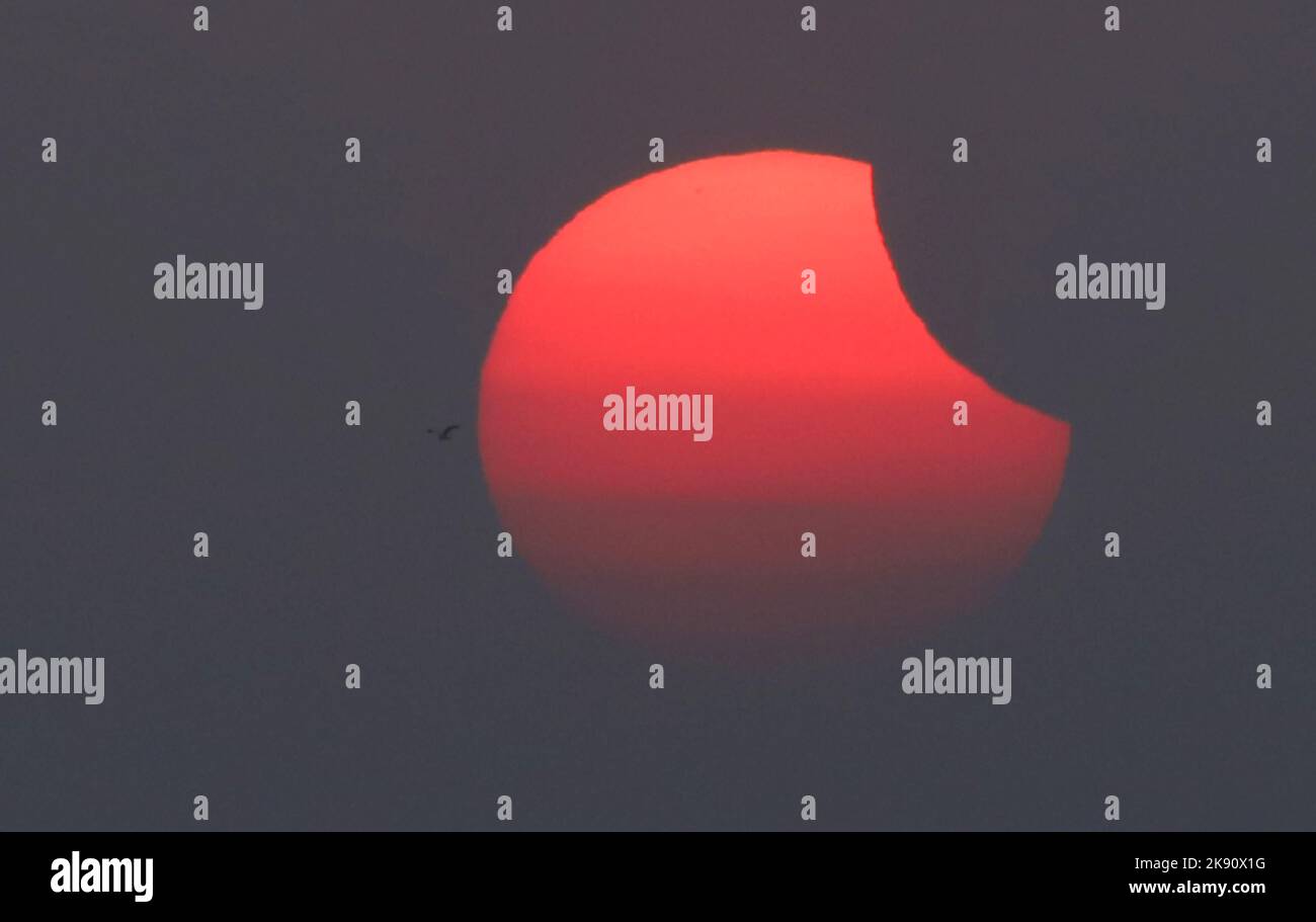 Bangalore, India. 25th Oct, 2022. A partial solar eclipse is pictured ...