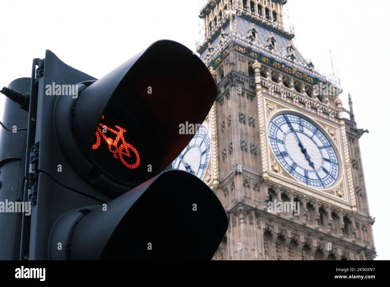 A low angle shot of a traffic light and a clock on the tower Stock ...