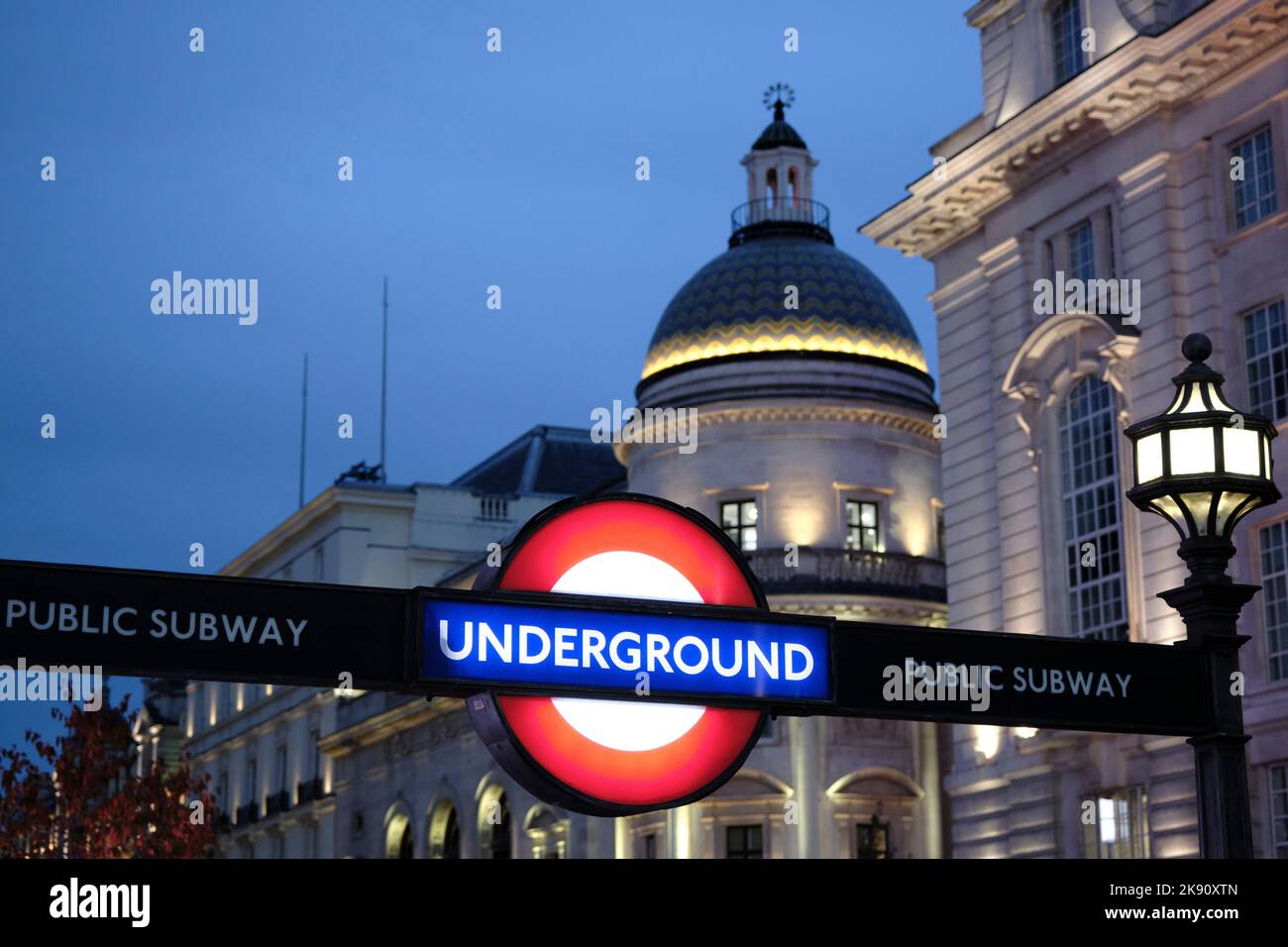 An underground signage with a monument building background Stock Photo ...