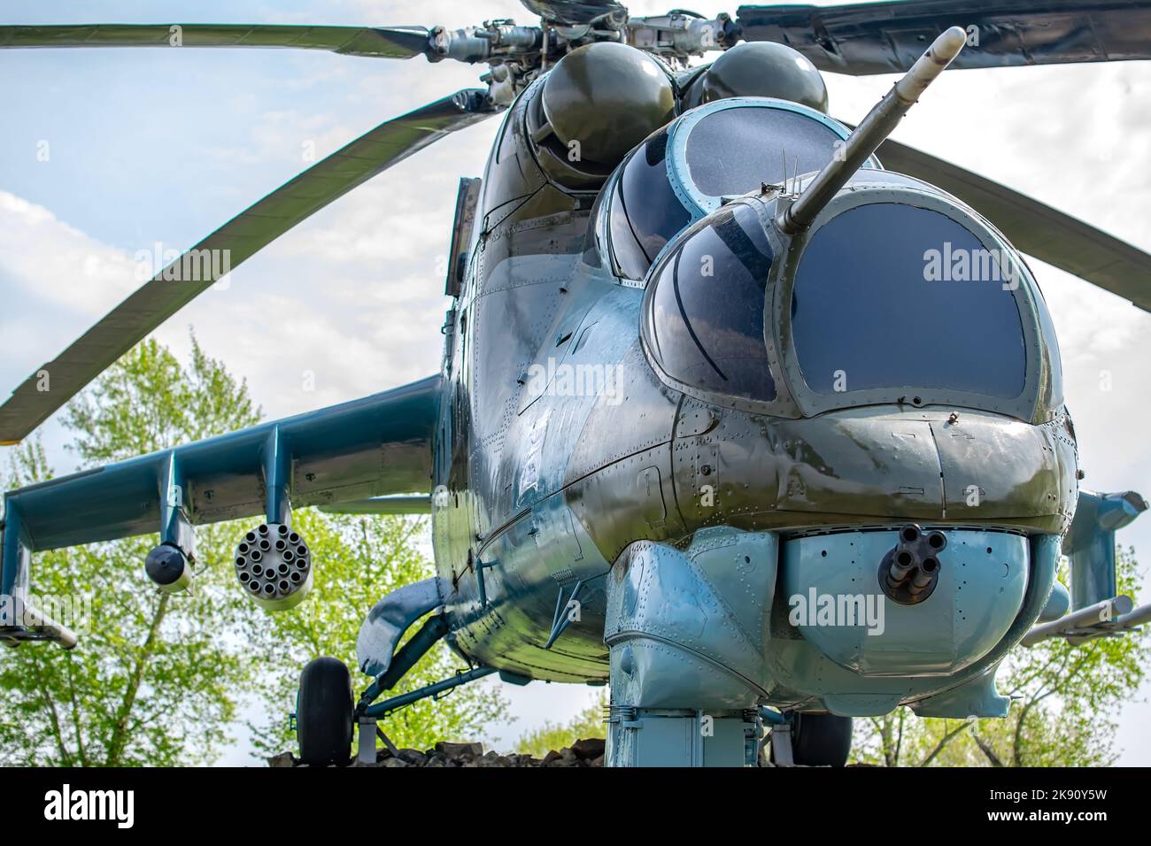 close up, front view of an old Soviet combat helicopter with suspended ...