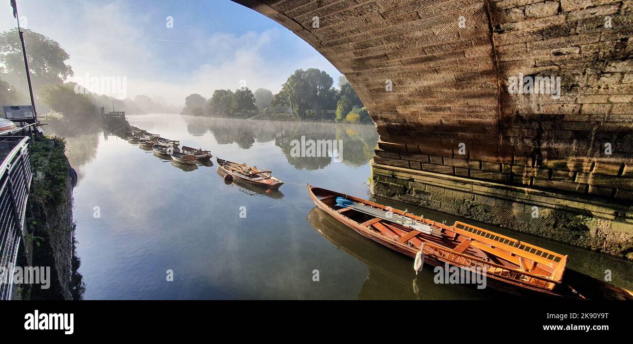 A boat line up on the river under the bridge Stock Photo - Alamy