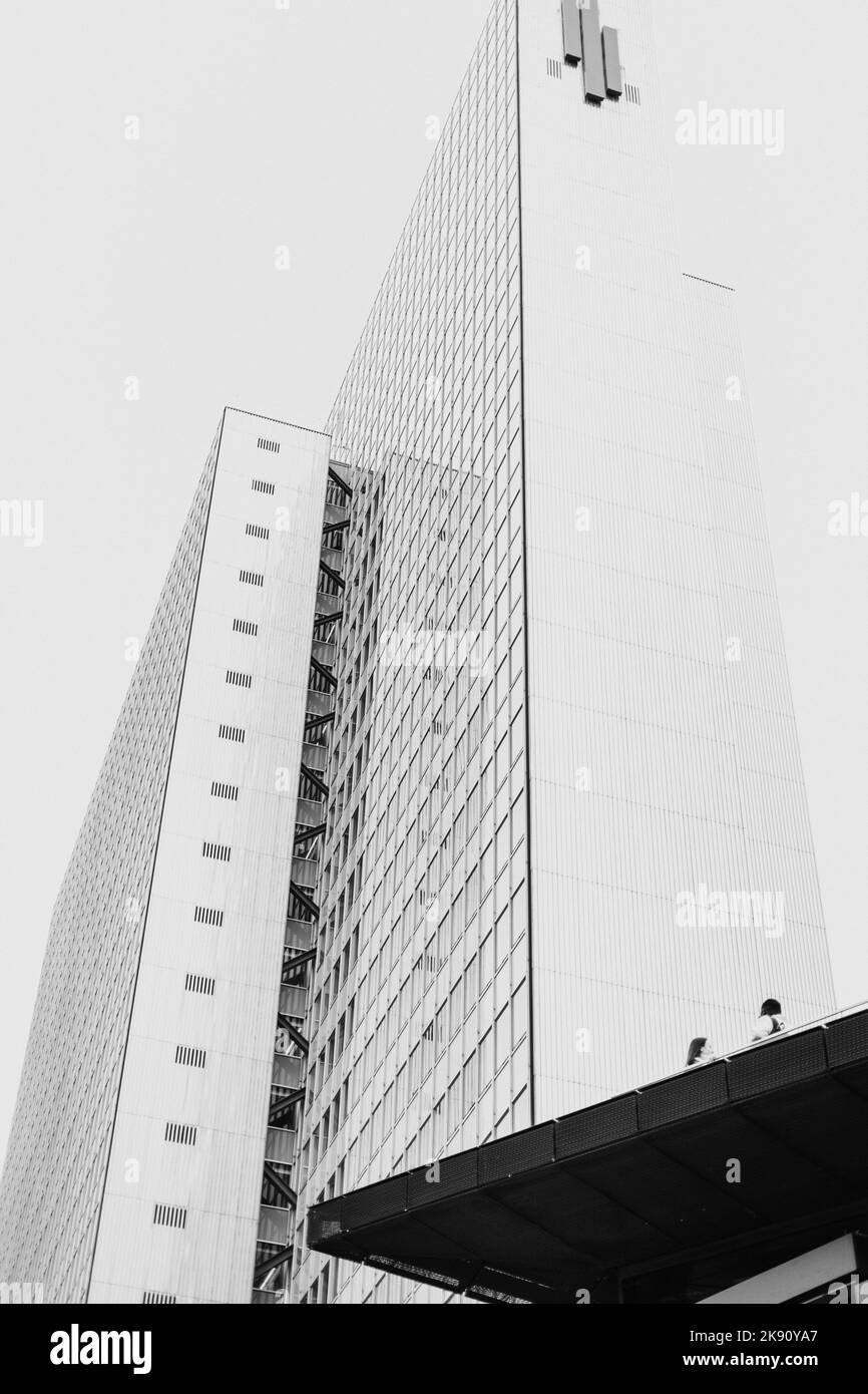 A greyscale shot of a tall modern building Stock Photo - Alamy