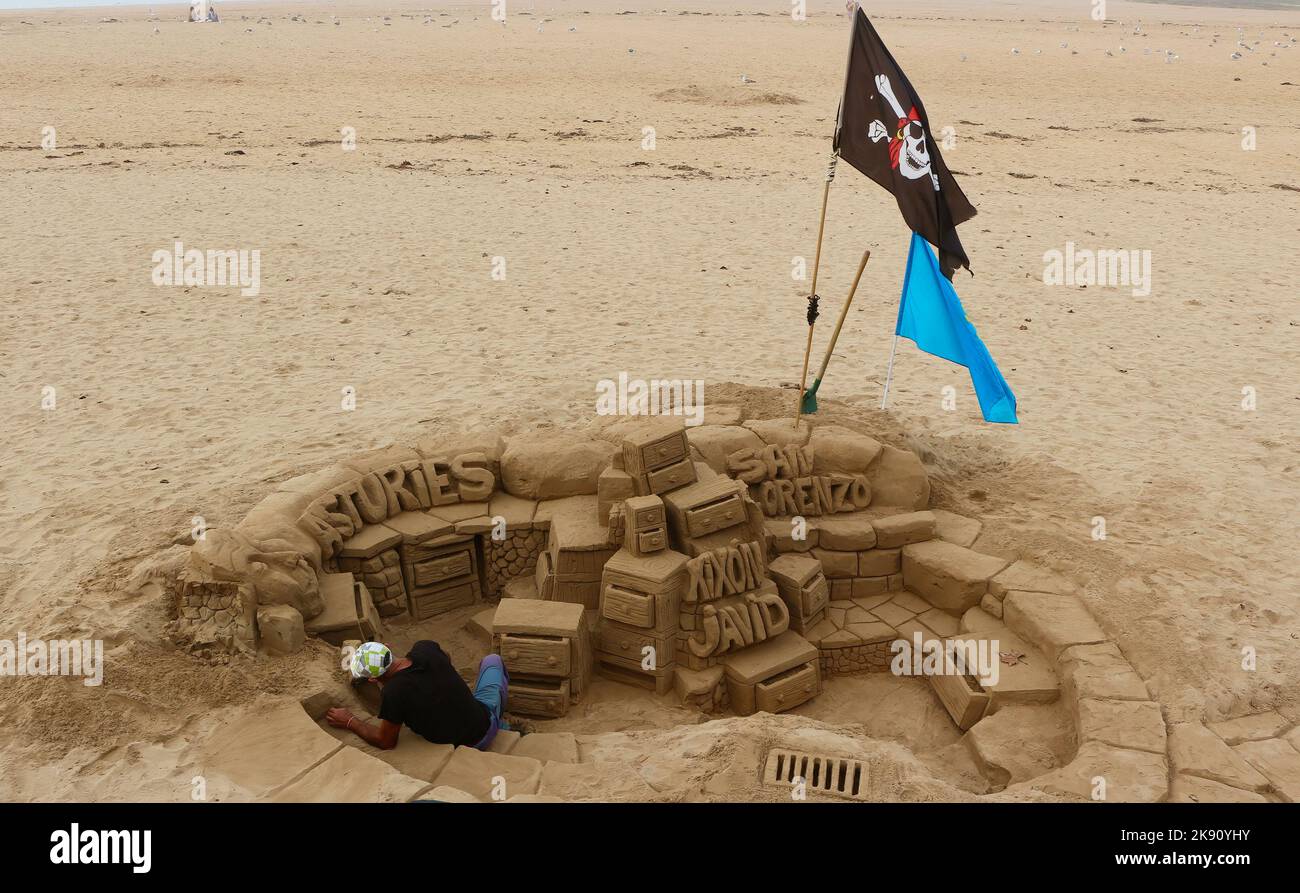 Sand sculptor working creating chests of drawers on the beach Playa de ...