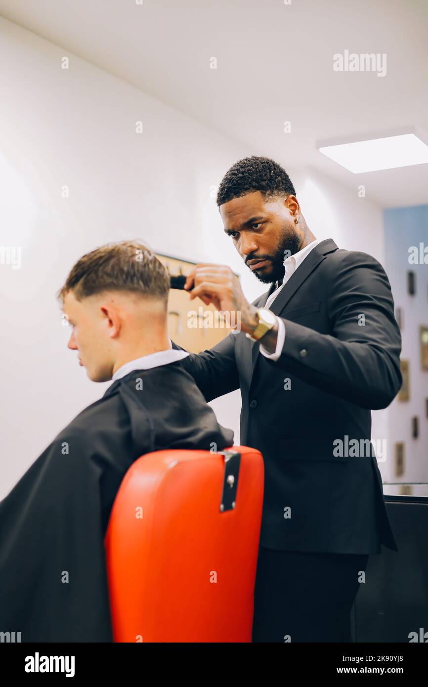 Vertical shot african american barber hi-res stock photography and ...