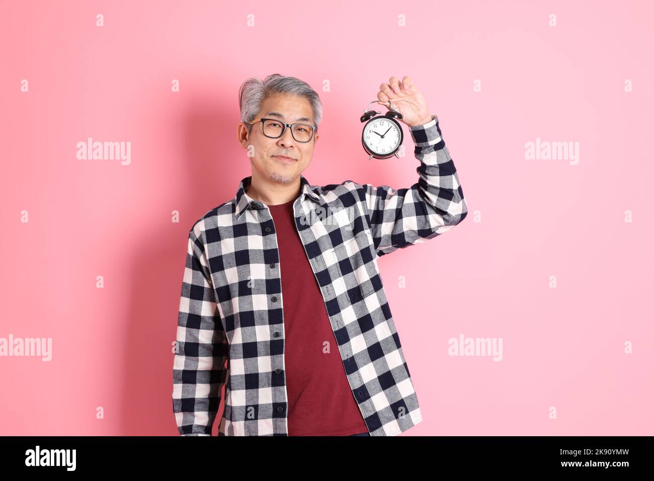 The 40s adult Asian man stnading on the pink background with casual ...