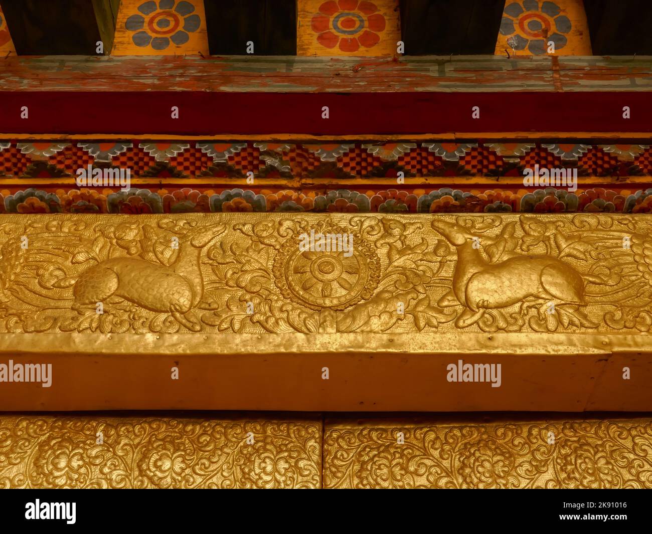 Gold repousse metal symbol of Buddha's first sermon in deer park in ...