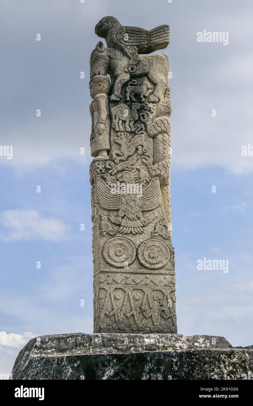 Stone carving with bird, horse, deer, crocodile, camel and human on ...