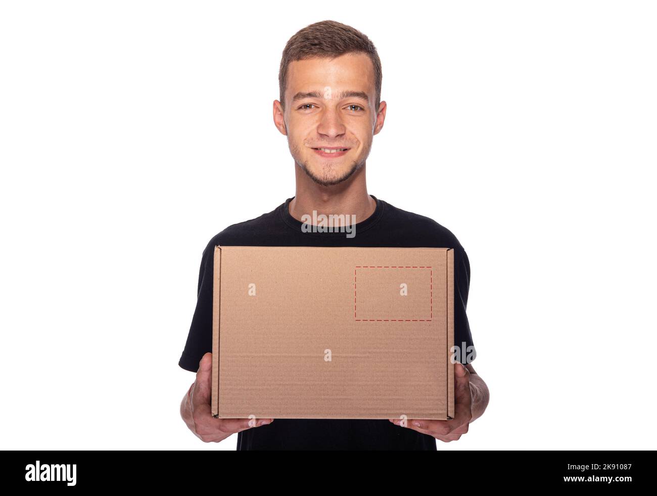 Young caucasian man holding package hi-res stock photography and images ...