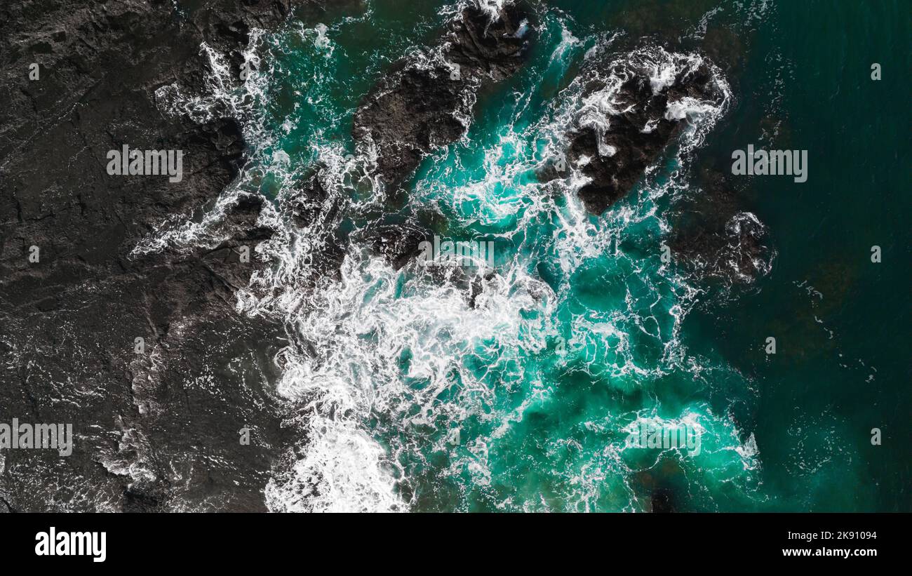 A closeup of sea foam poster, green waves with a long exposure effect ...