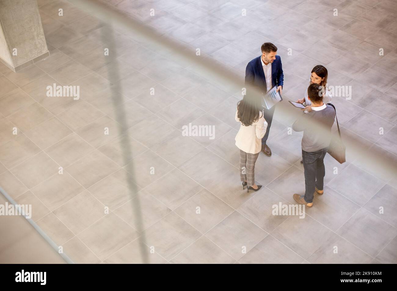 Four people talking aerial hi-res stock photography and images - Alamy