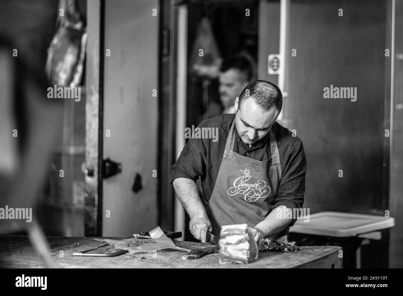 The butcher preparing an order at London's Borough Market, close-up ...
